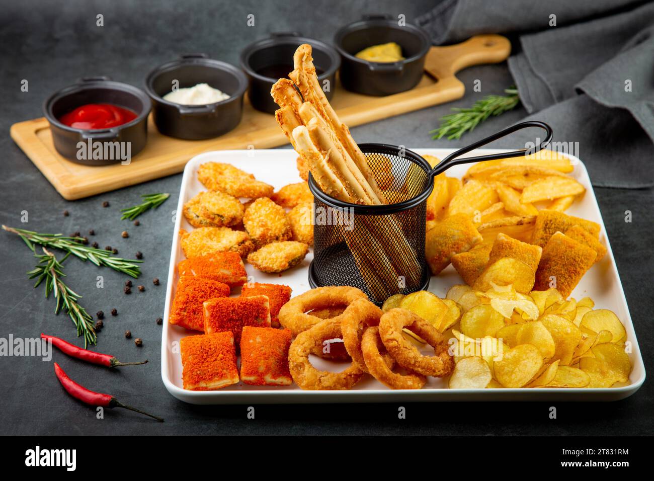 beer plate with onion rings, chips and nuggets side view Stock Photo ...