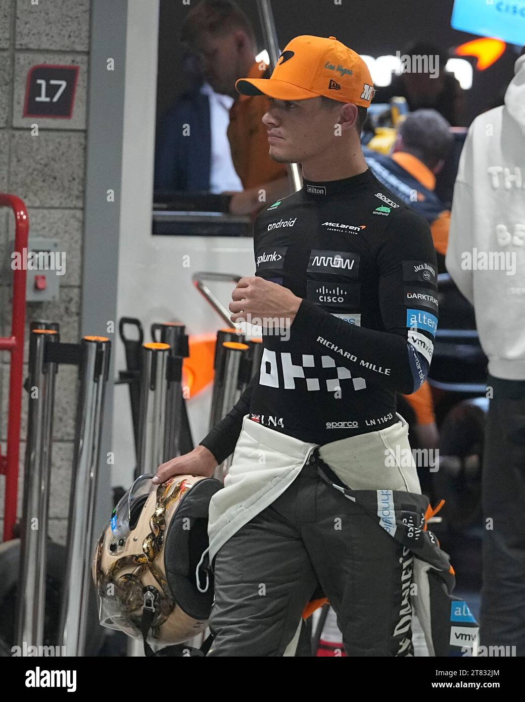 McLaren driver Lando Norris, of Britain, walks down pit lane after ...
