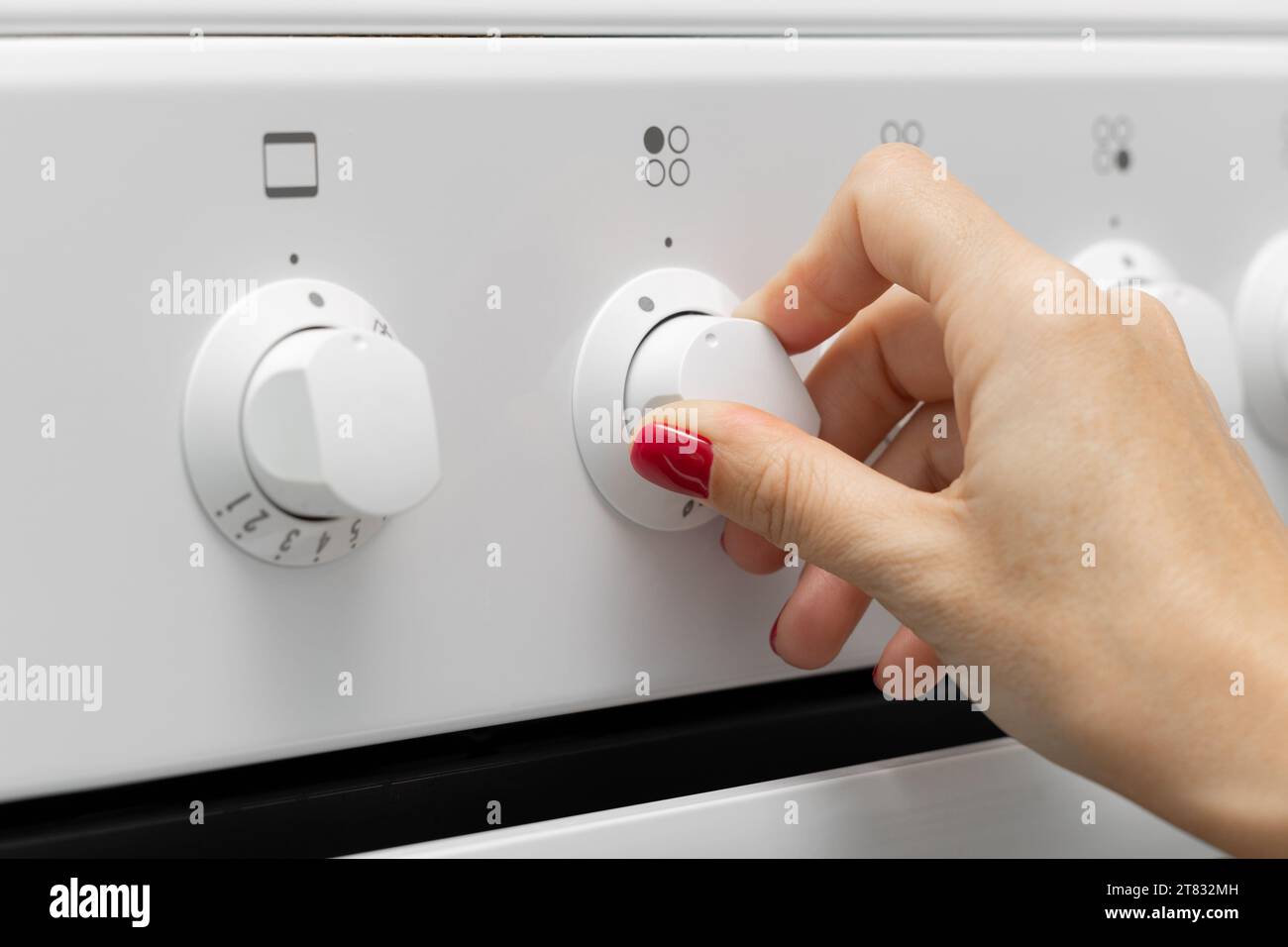 a woman's hand rotates the selector on a gas stove. woman's hand turns ...