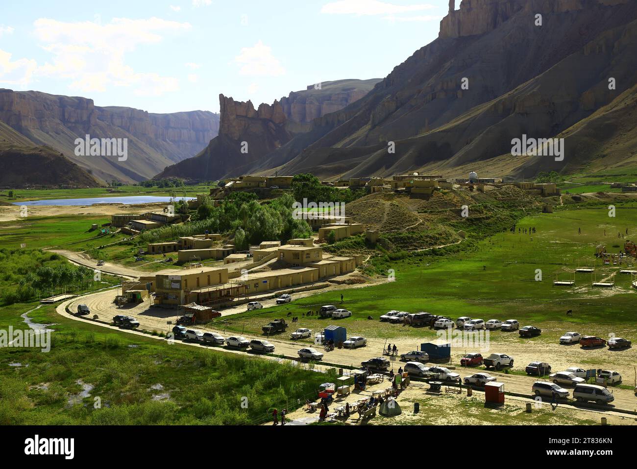A picturesque view of a mountainous valley landscape featuring a ...