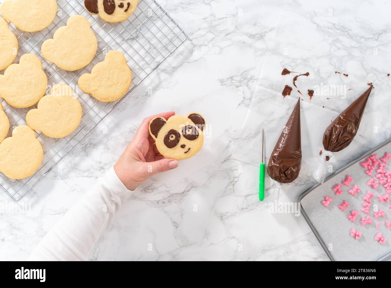 Panda shaped shortbread cookies with chocolate icing Stock Photo - Alamy