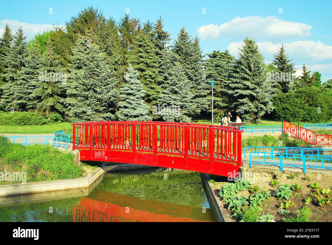 Metal concrete stone bridge with rails over the river Stock Photo - Alamy