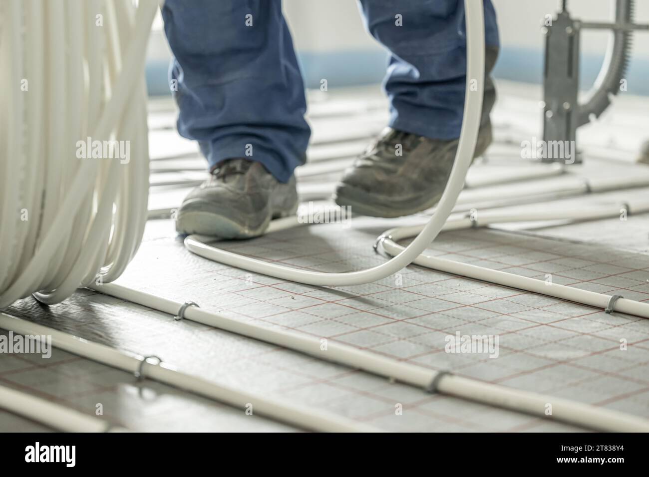installing floor heating, modernization to save energy Stock Photo - Alamy