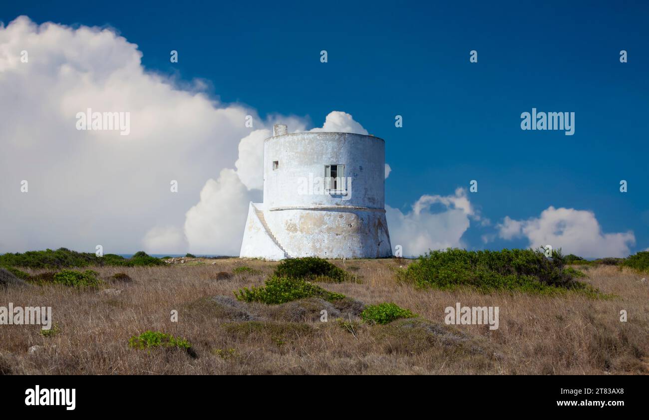 A cylindrical white tower with a flat roof and a small window. Built in ...
