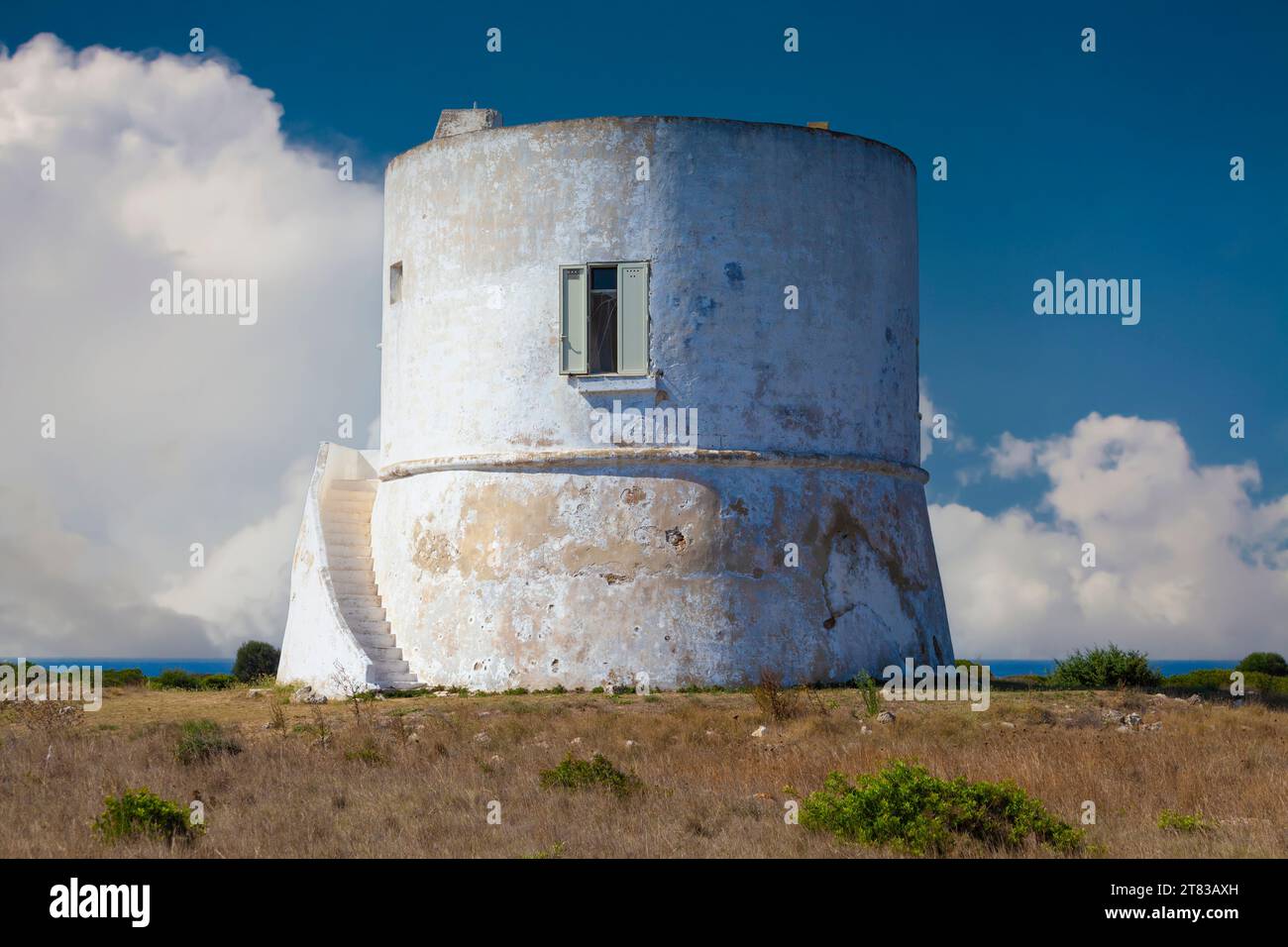 A cylindrical white tower with a flat roof and a small window. Built in ...