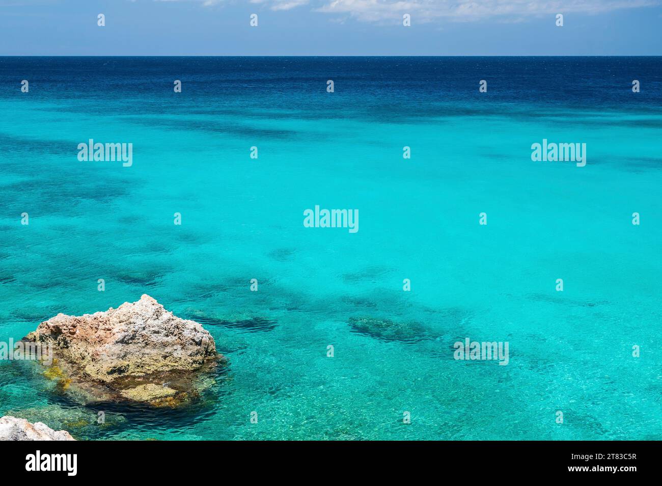 A tropical ocean, with a crystal clear, turquoise sea. The location is ...