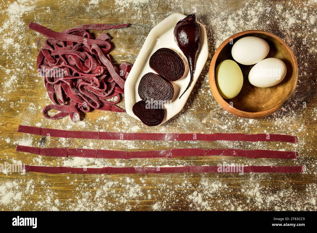 Purple noodles with ingredients on the table, homemade italian food ...