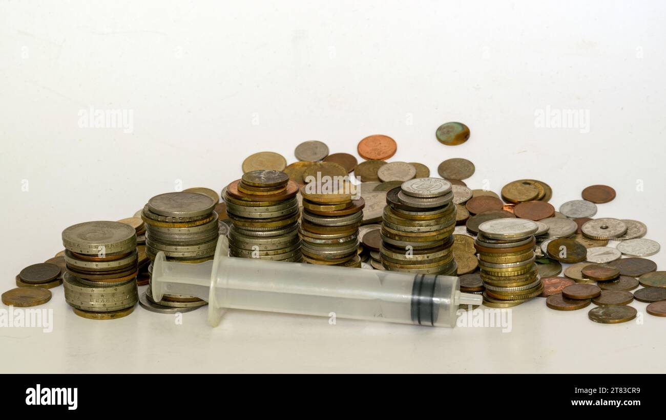 a photograph with metal coins of various shapes, countries and values ...