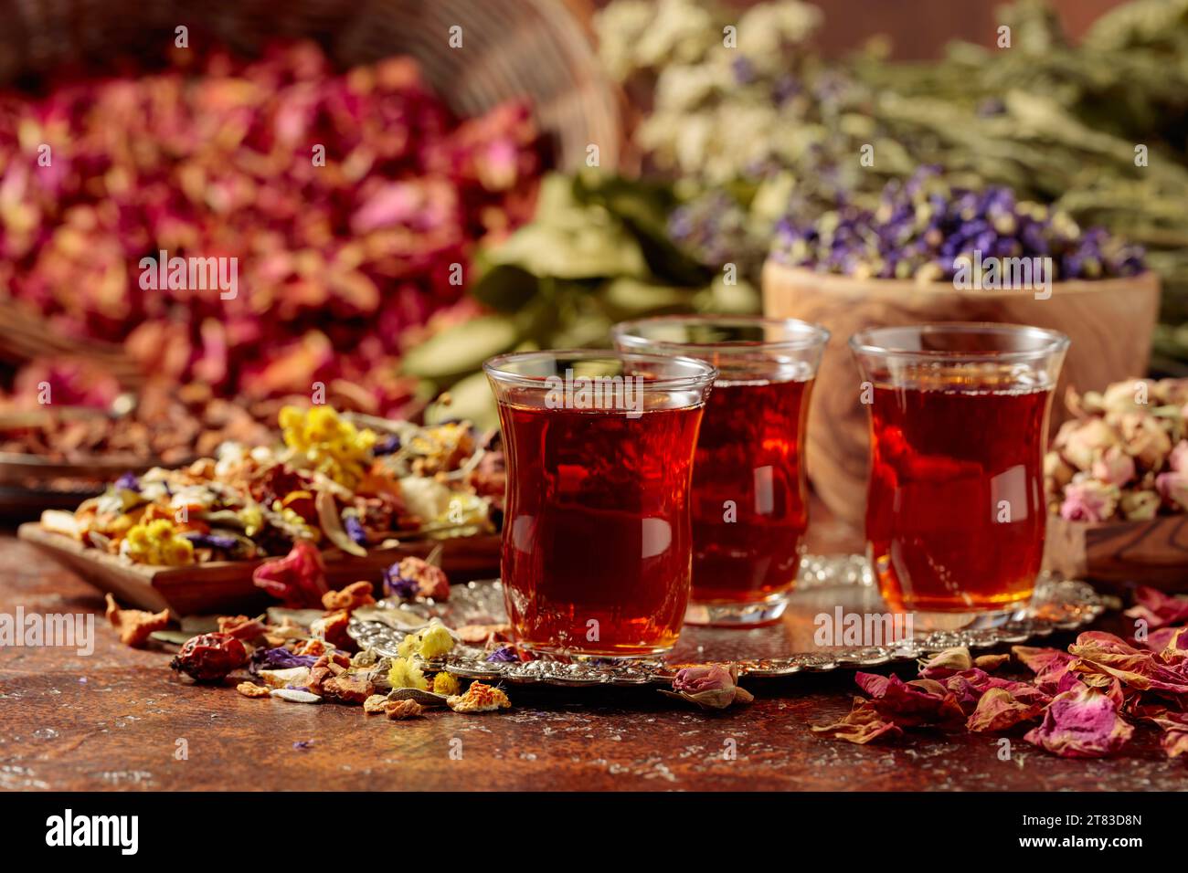 Herbal tea and a mix of various dried medicinal plants and herbs on a ...