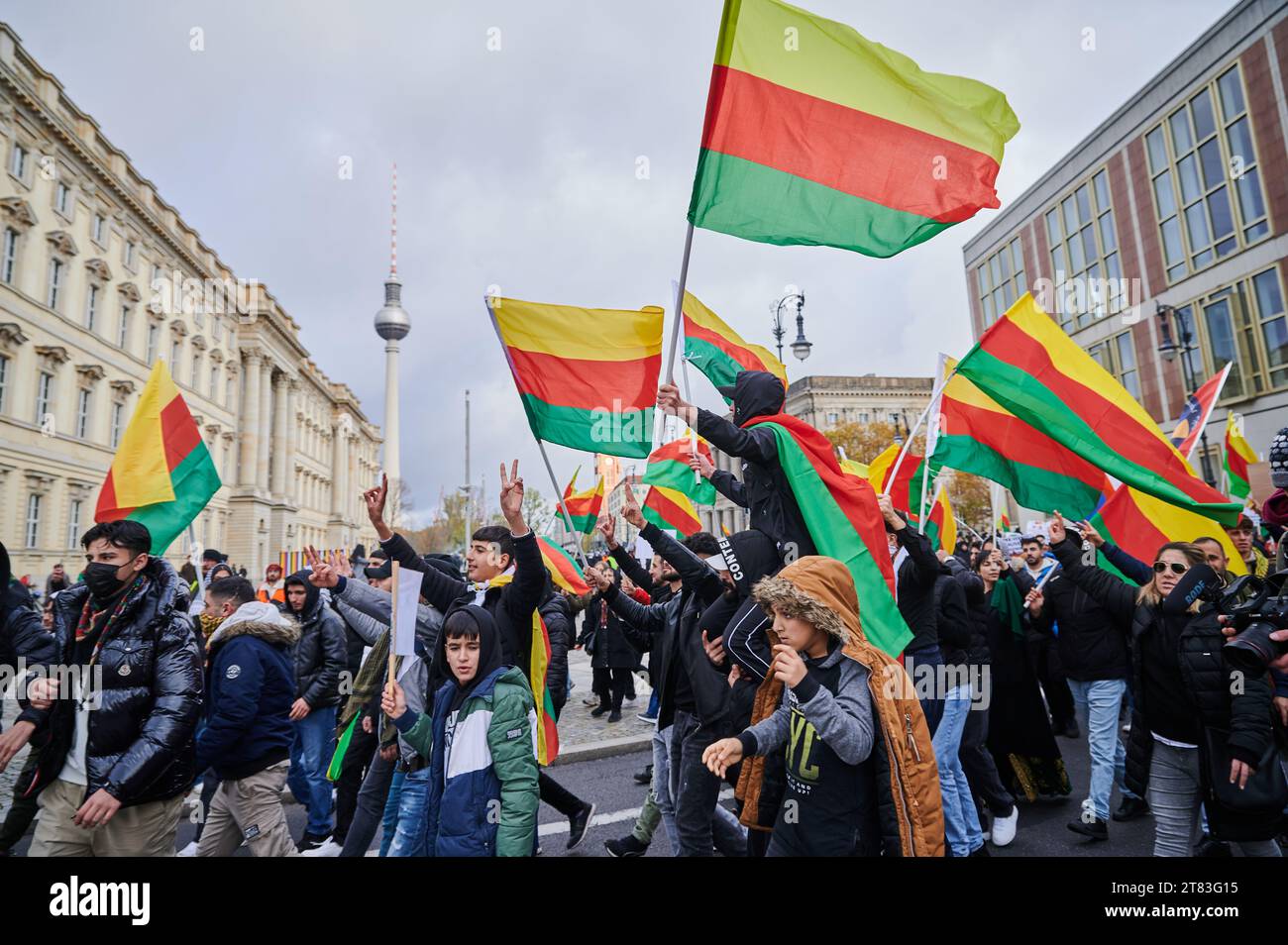 Berlin, Germany. 18th Nov, 2023. Demonstrators wave yellow-red-green ...