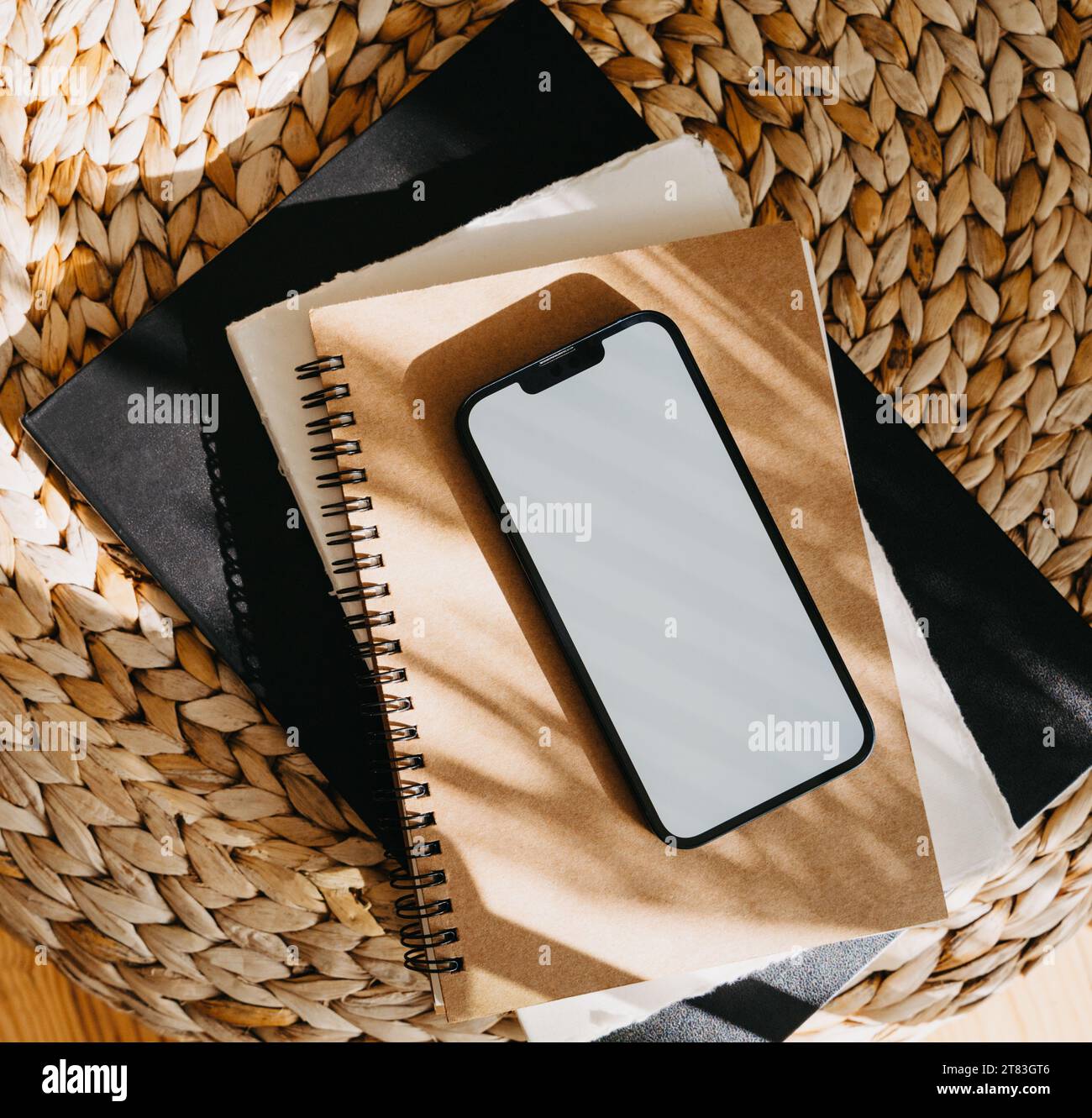 Blank path screen mobile phone with mockup on various notepads in ...