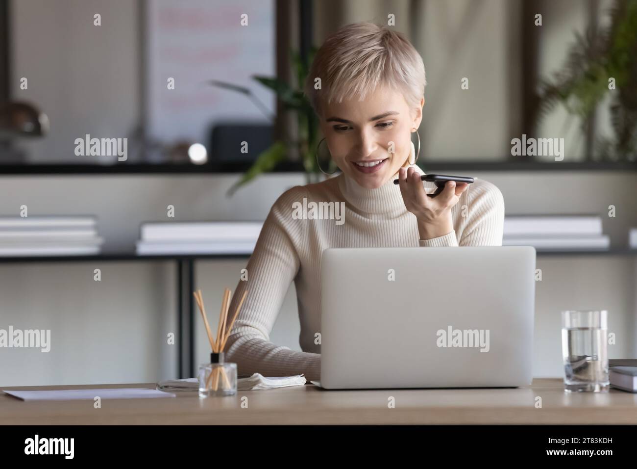 Businesswoman using voice recognition virtual hi-res stock photography ...