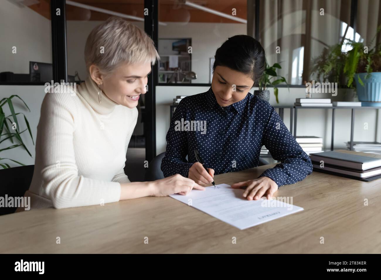 HR manager, helping new employee to fill job application form Stock ...