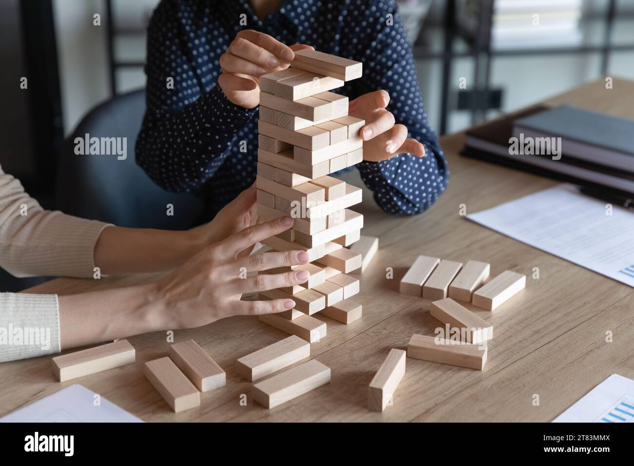 Business team colleagues playing jenga board game together Stock Photo ...