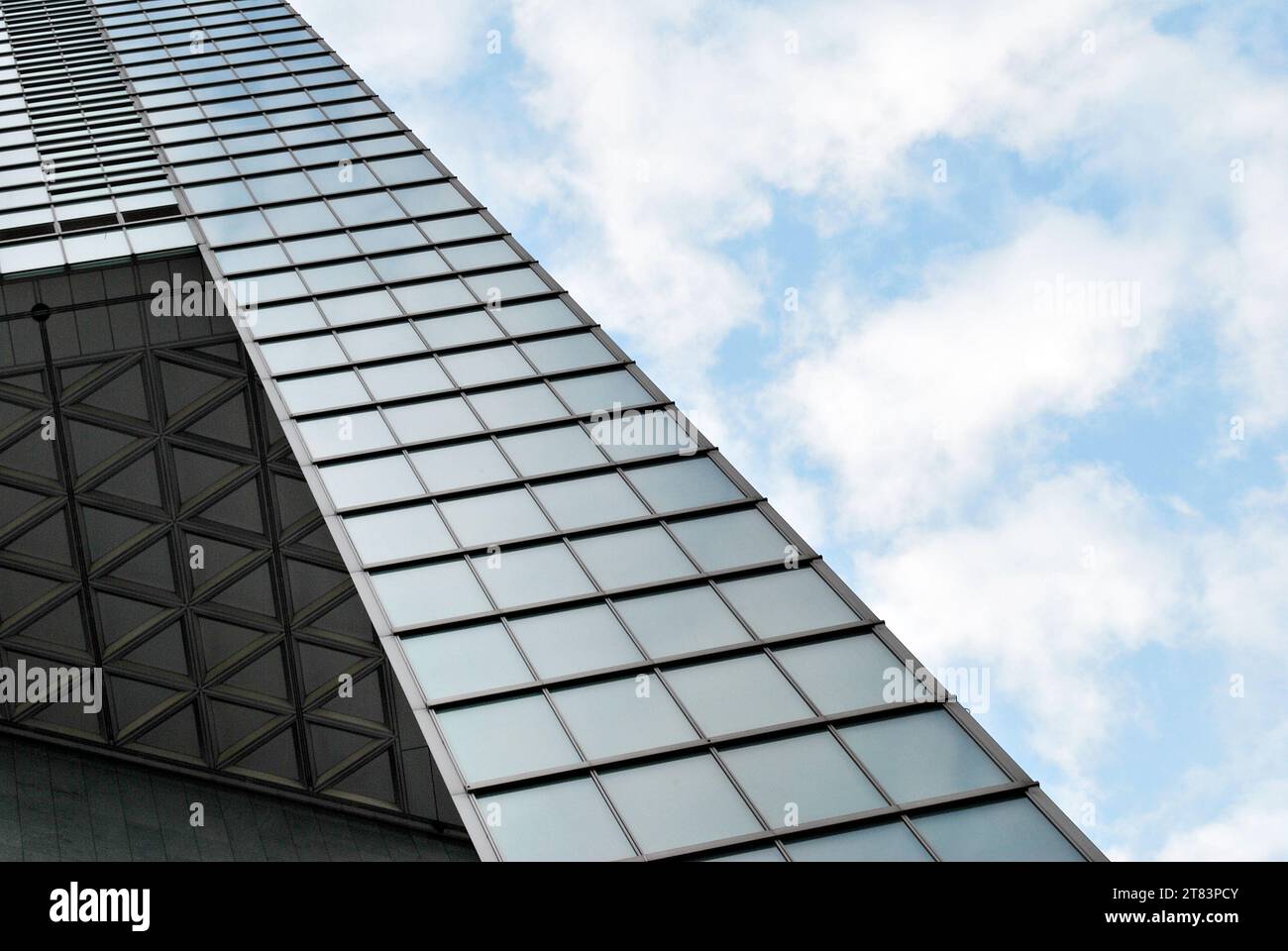 Abstract closeup of the glass-clad facade of a modern building covered ...