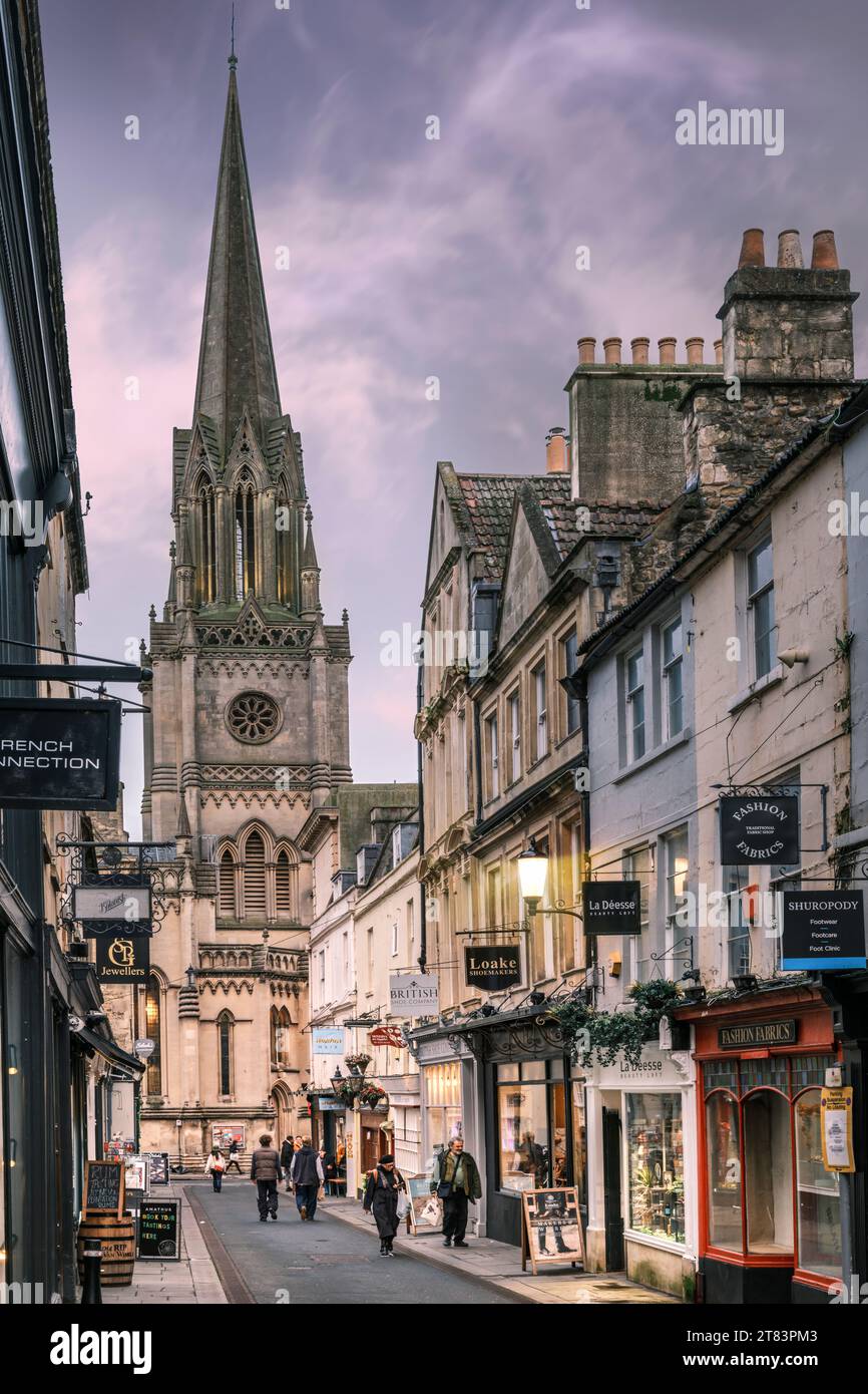 The street lights turn on as the sun goes down on a cold November ...