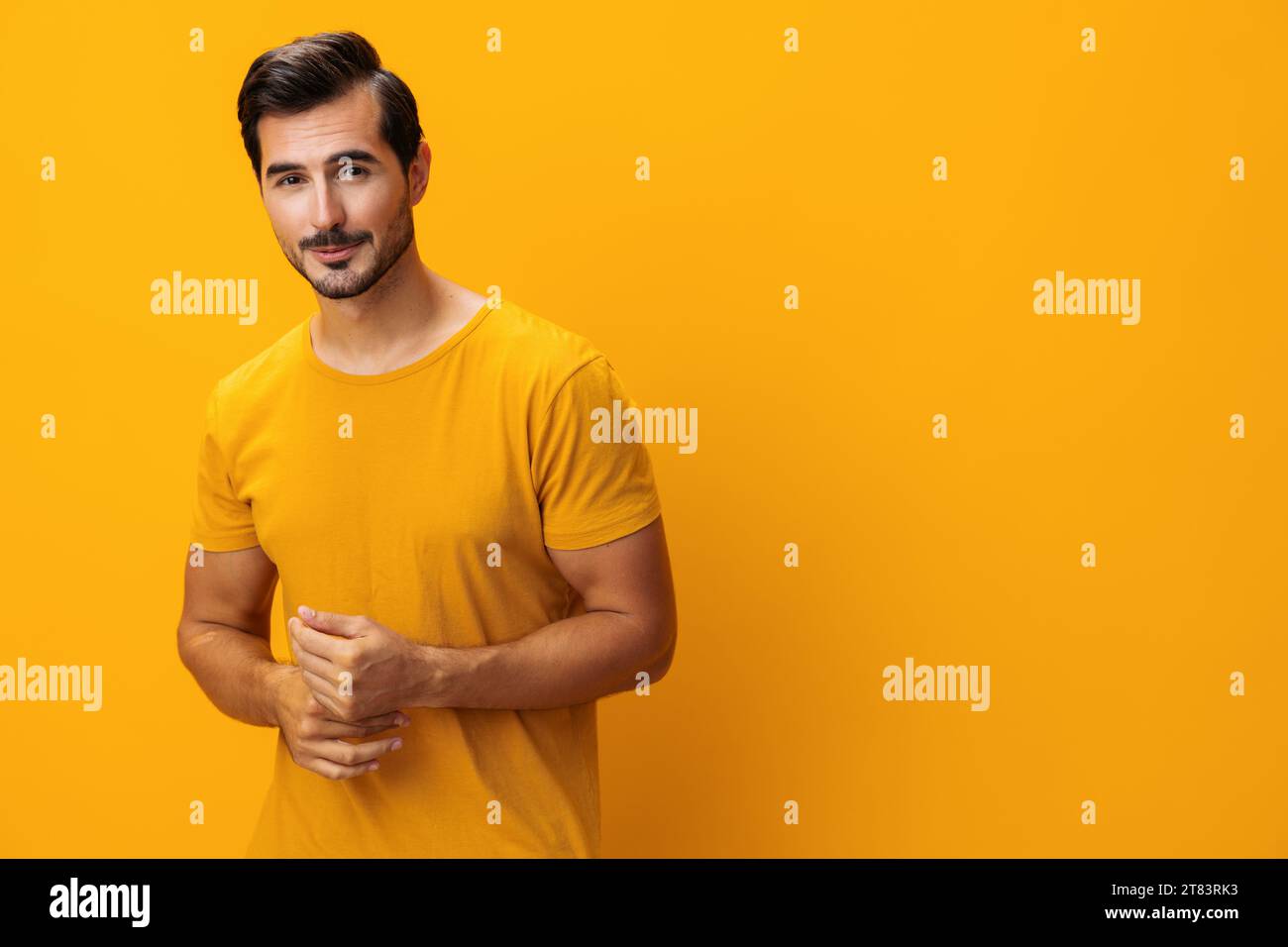 Man studio yellow style arm portrait background smiling confident space ...