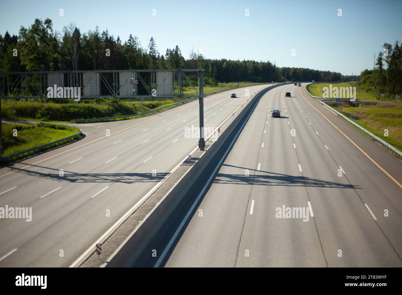 Cars drive on the highway. Transport on the road. Low traffic on the ...