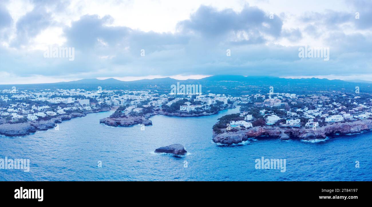 Aerial view of Cala Esmeralda at night , above the sea looking back at ...