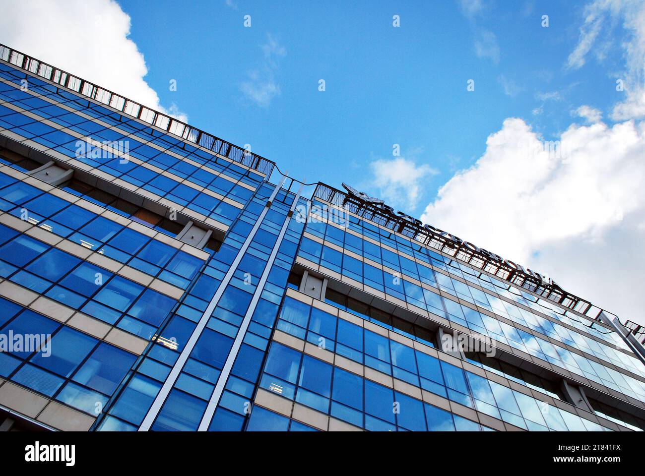 Abstract closeup of the glass-clad facade of a modern building covered ...
