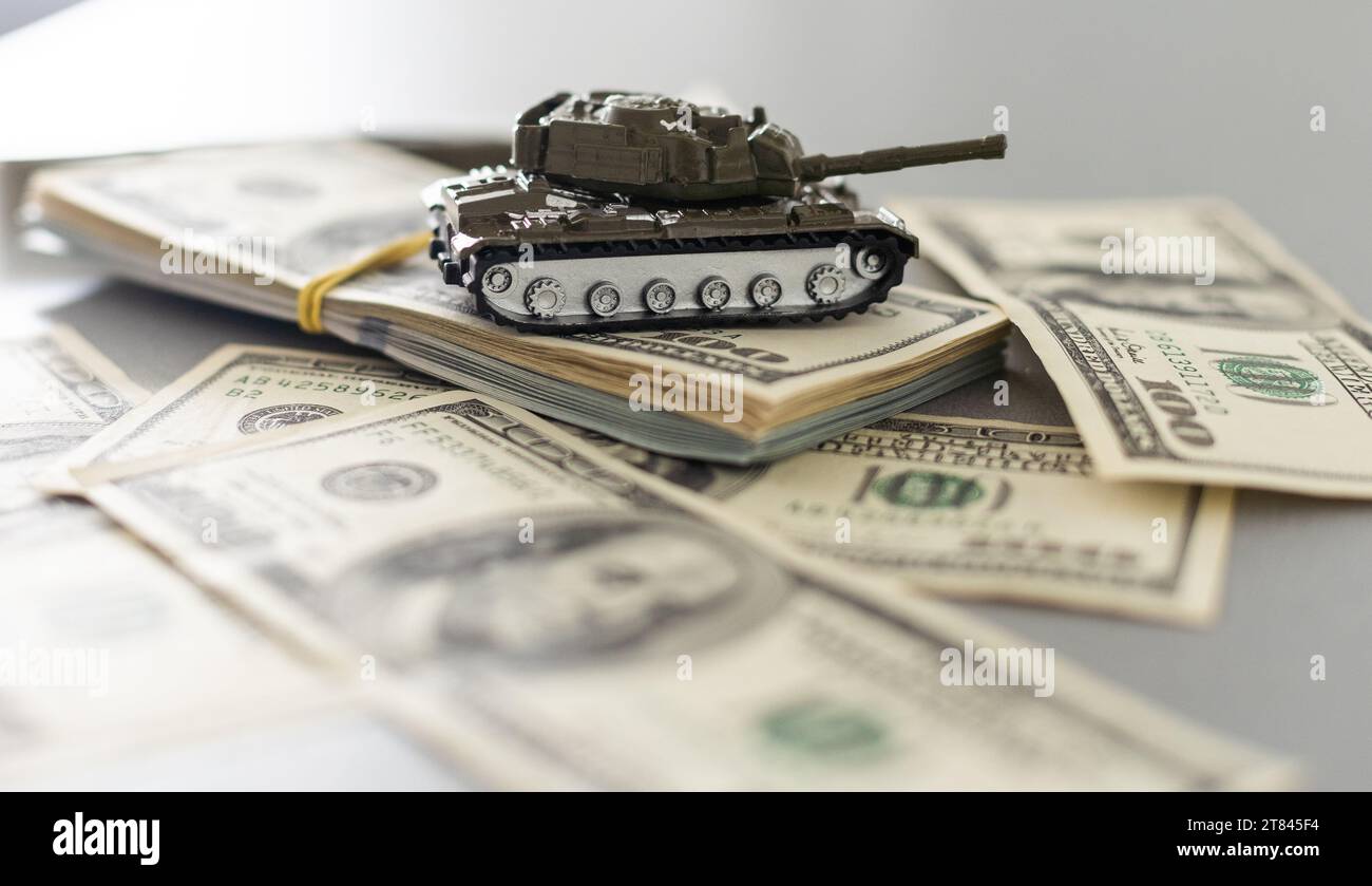 Tank on dollar bills. The concept of war costs, military spending Stock ...