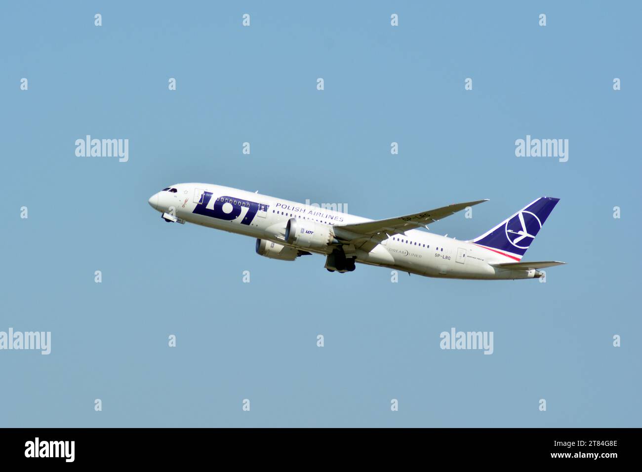 Warsaw, Poland. 15 April 2018. Passenger airplane is flying from the ...