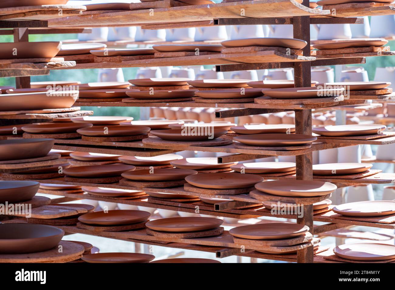 Hand crafted pottery air drying before first (Biscuit firing or Bisque ...