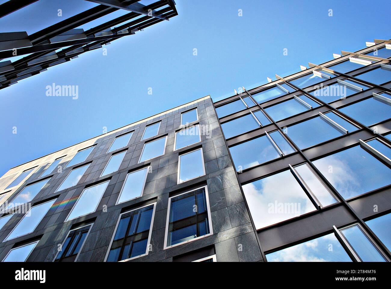 Abstract closeup of the glass-clad facade of a modern building covered ...