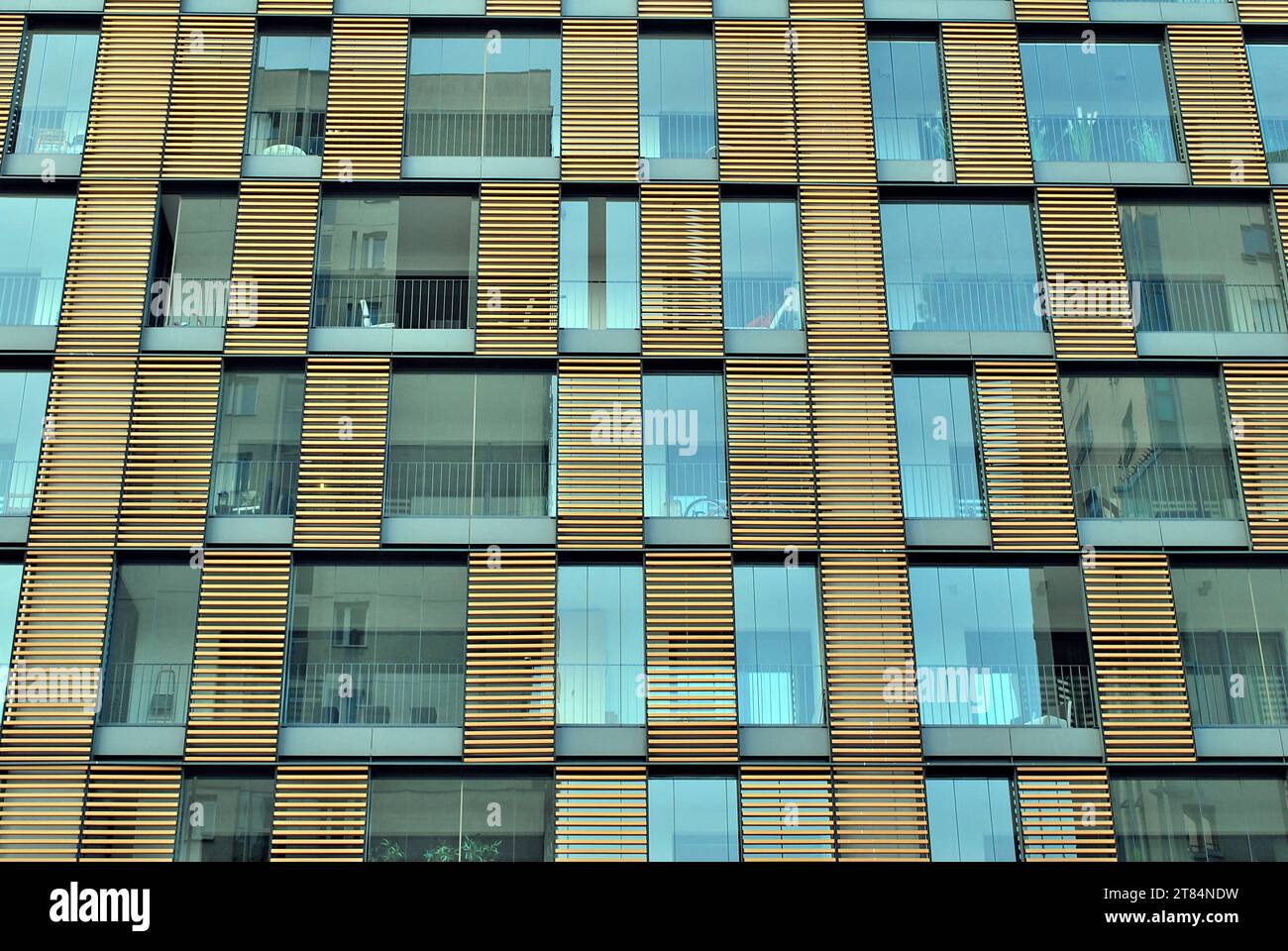Abstract closeup of the glass-clad facade of a modern building covered ...