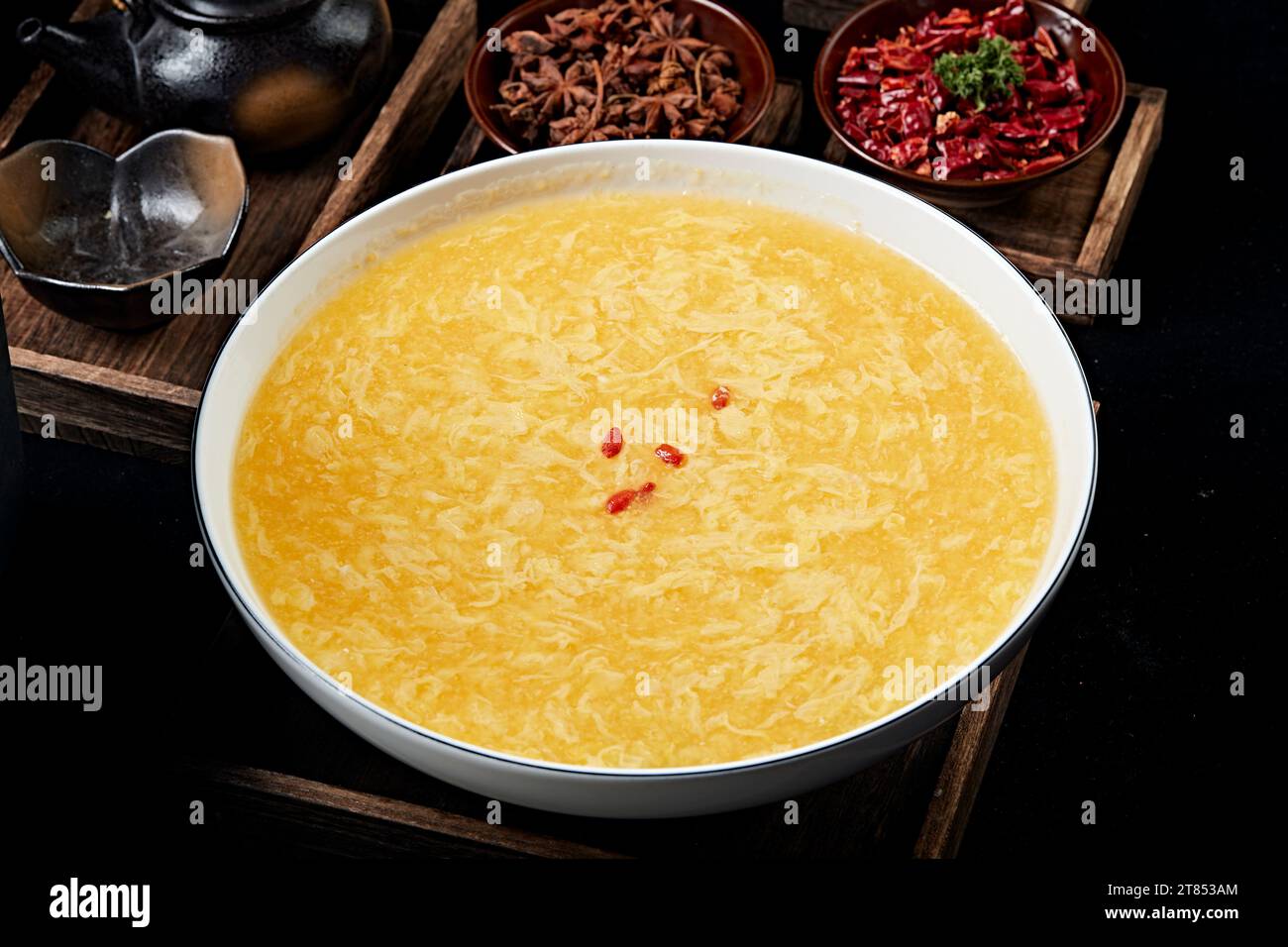 Sweet corn egg drop soup in white bowl, a very popular Cantonese hot ...