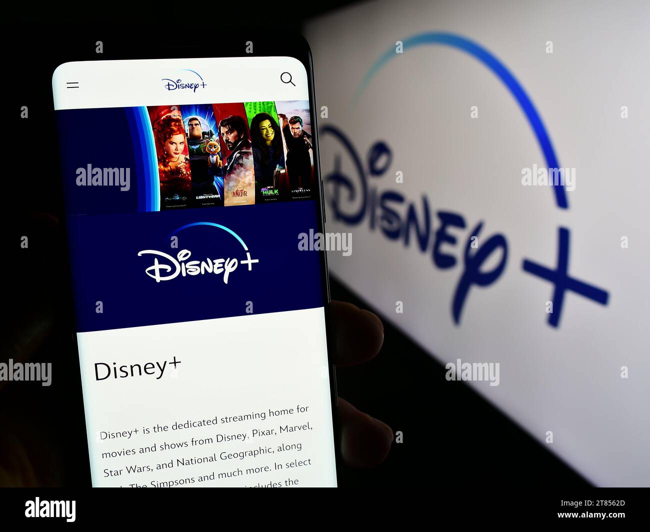 Person holding cellphone with web page of US video-on-demand streaming ...