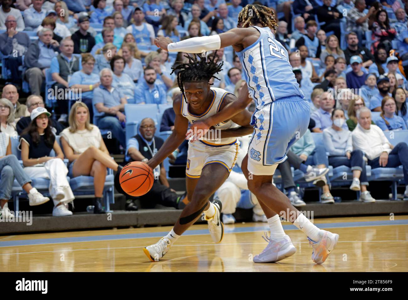 UC Riverside guard Nate Pickens, left, tries to drive around North ...