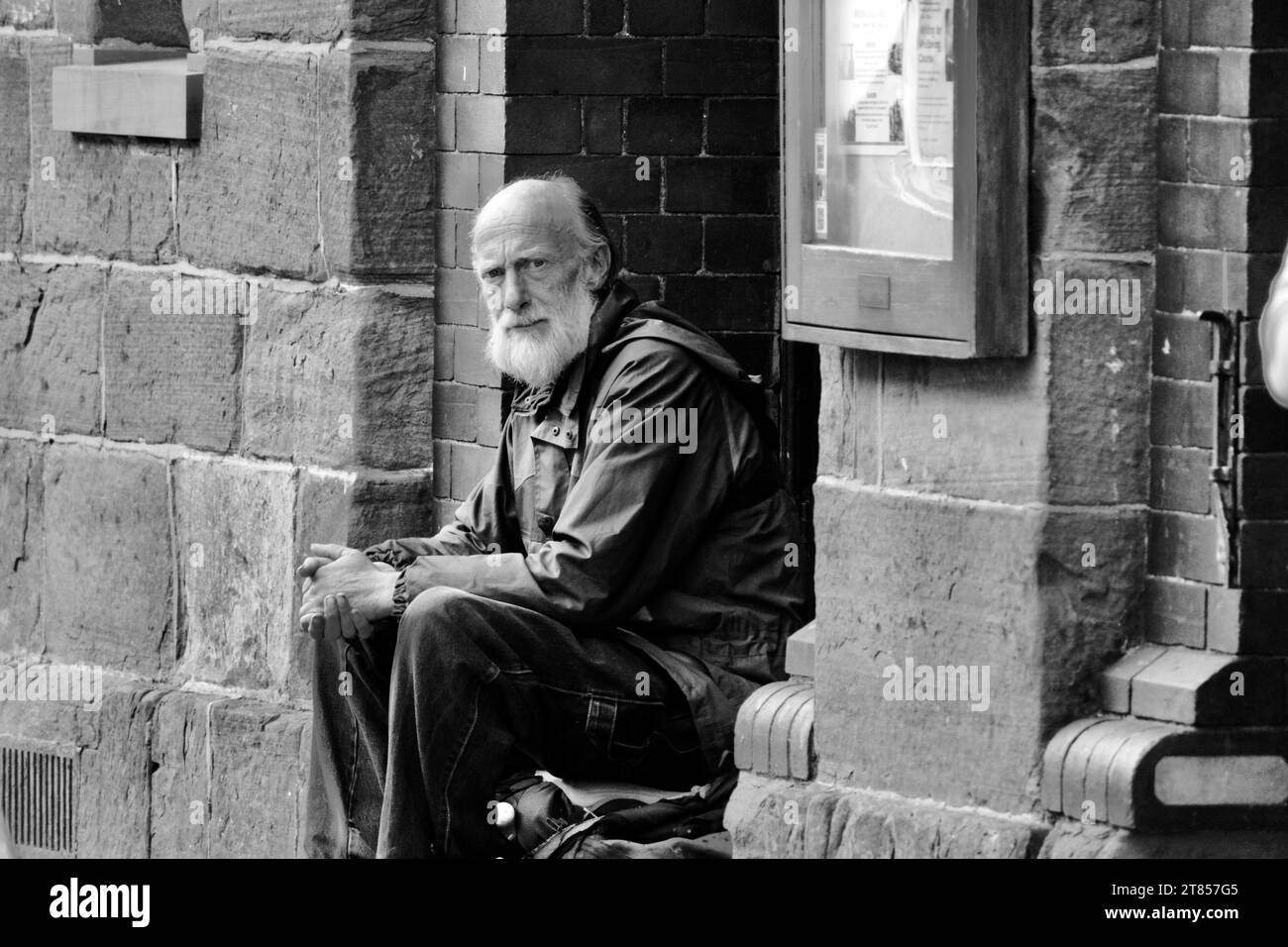 Brecon, Powys, Wales Oct 22 2023: Grey haired old homeless man with a ...