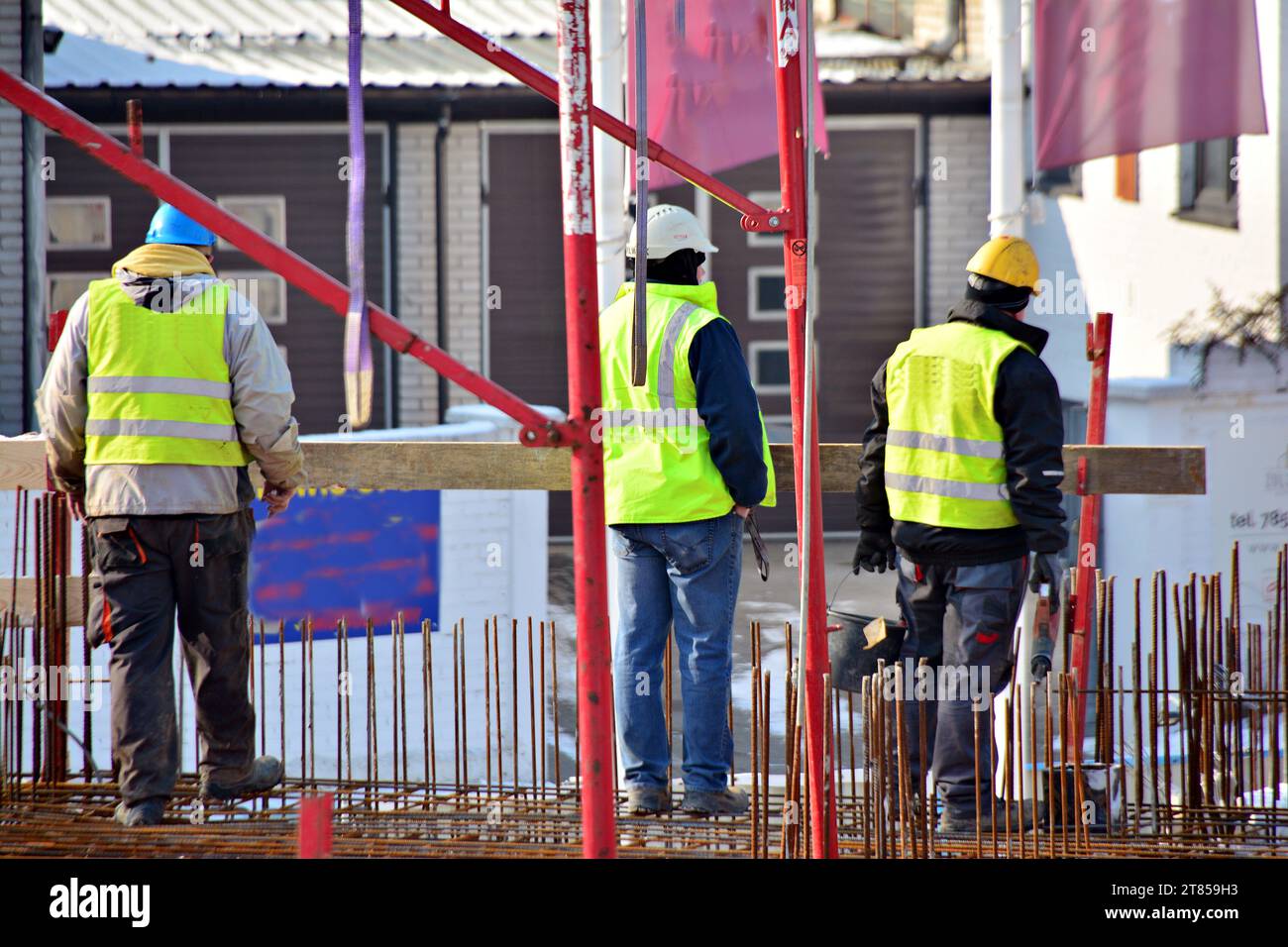 Construction site workers. Apartment building under construction Stock ...