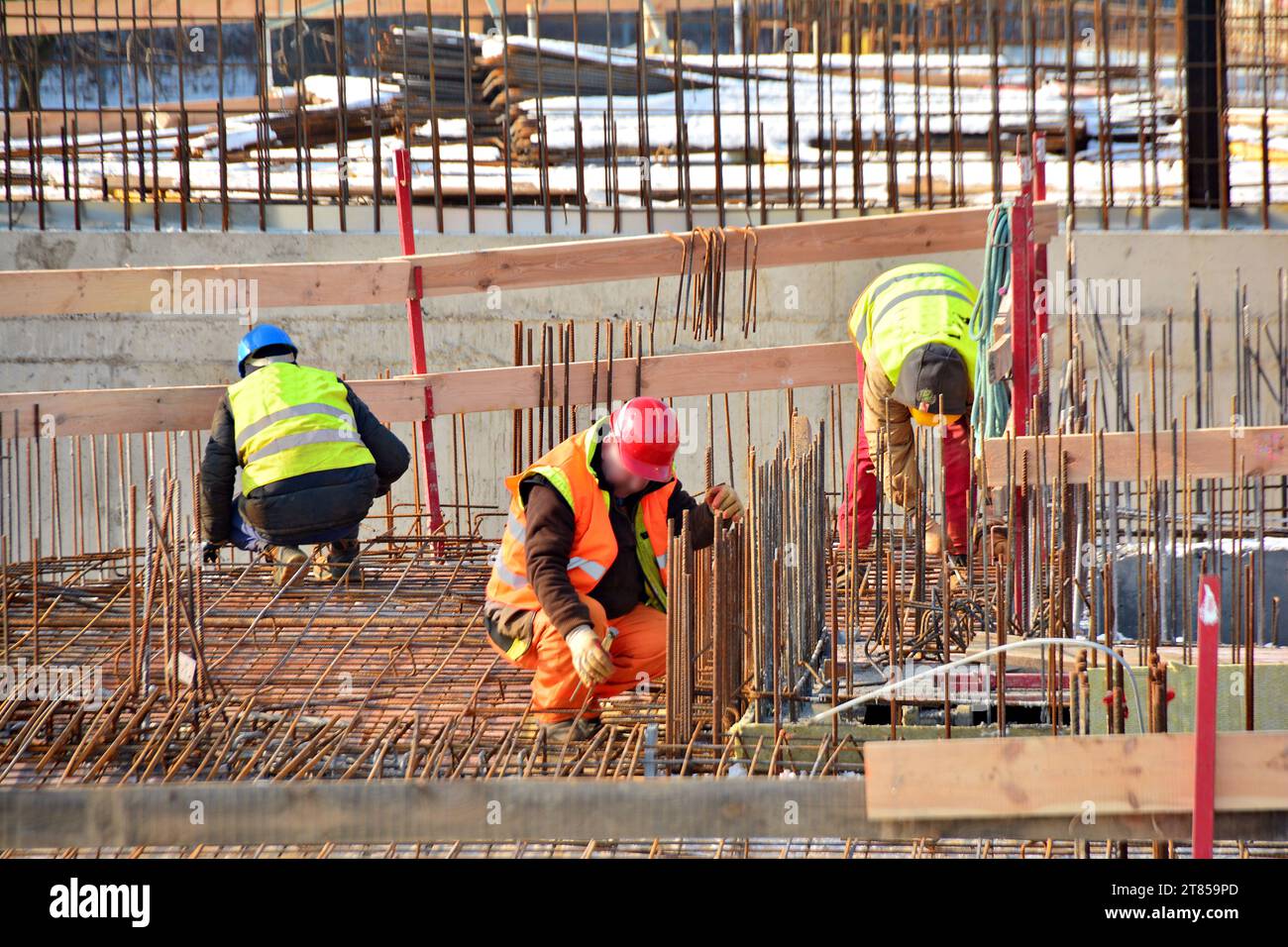 Construction site workers. Apartment building under construction Stock ...