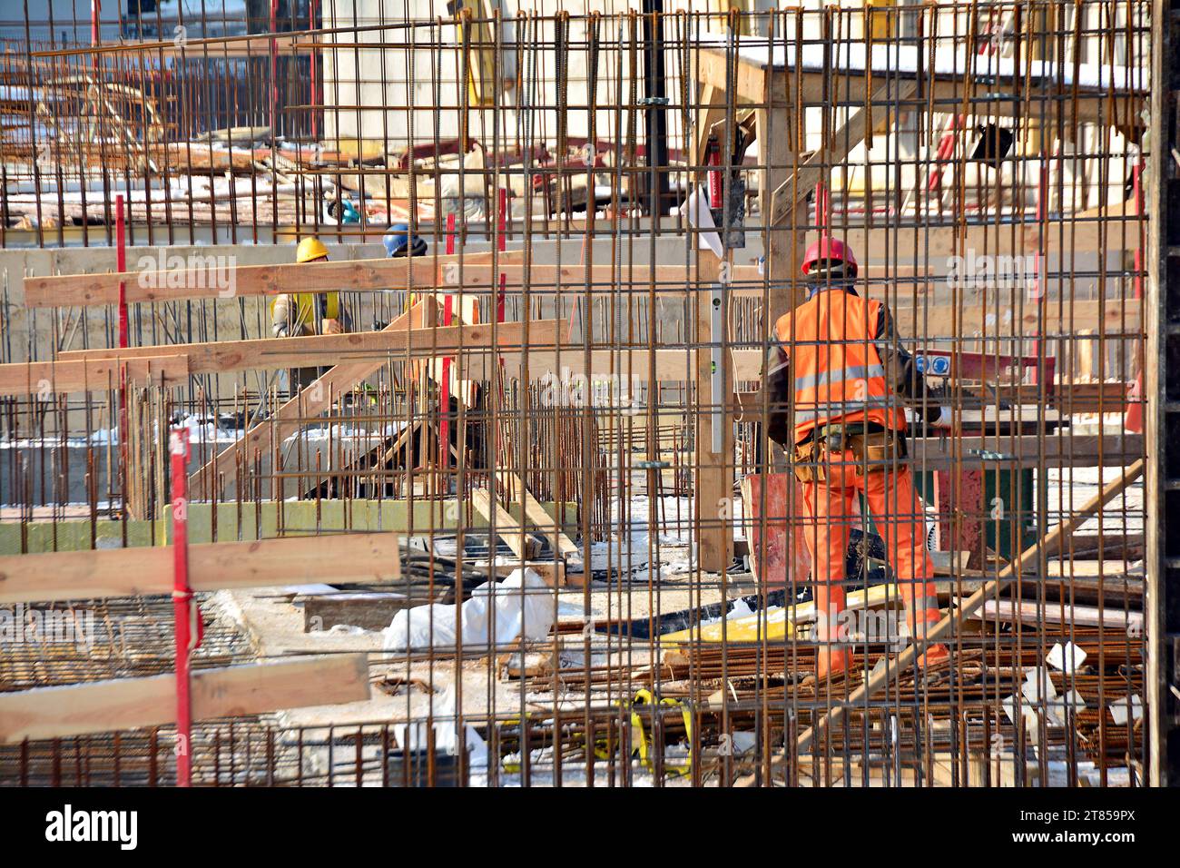 Construction site workers. Apartment building under construction Stock ...