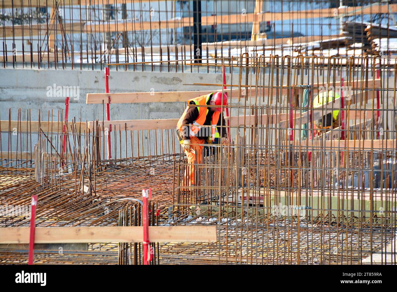 Construction site workers. Apartment building under construction Stock ...