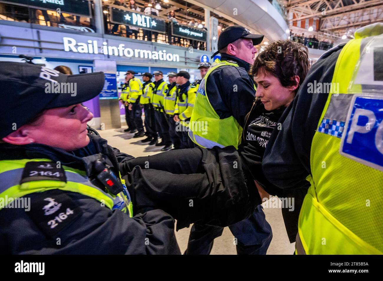 London, UK. 18th Nov, 2023. Police advance in a military formation and ...