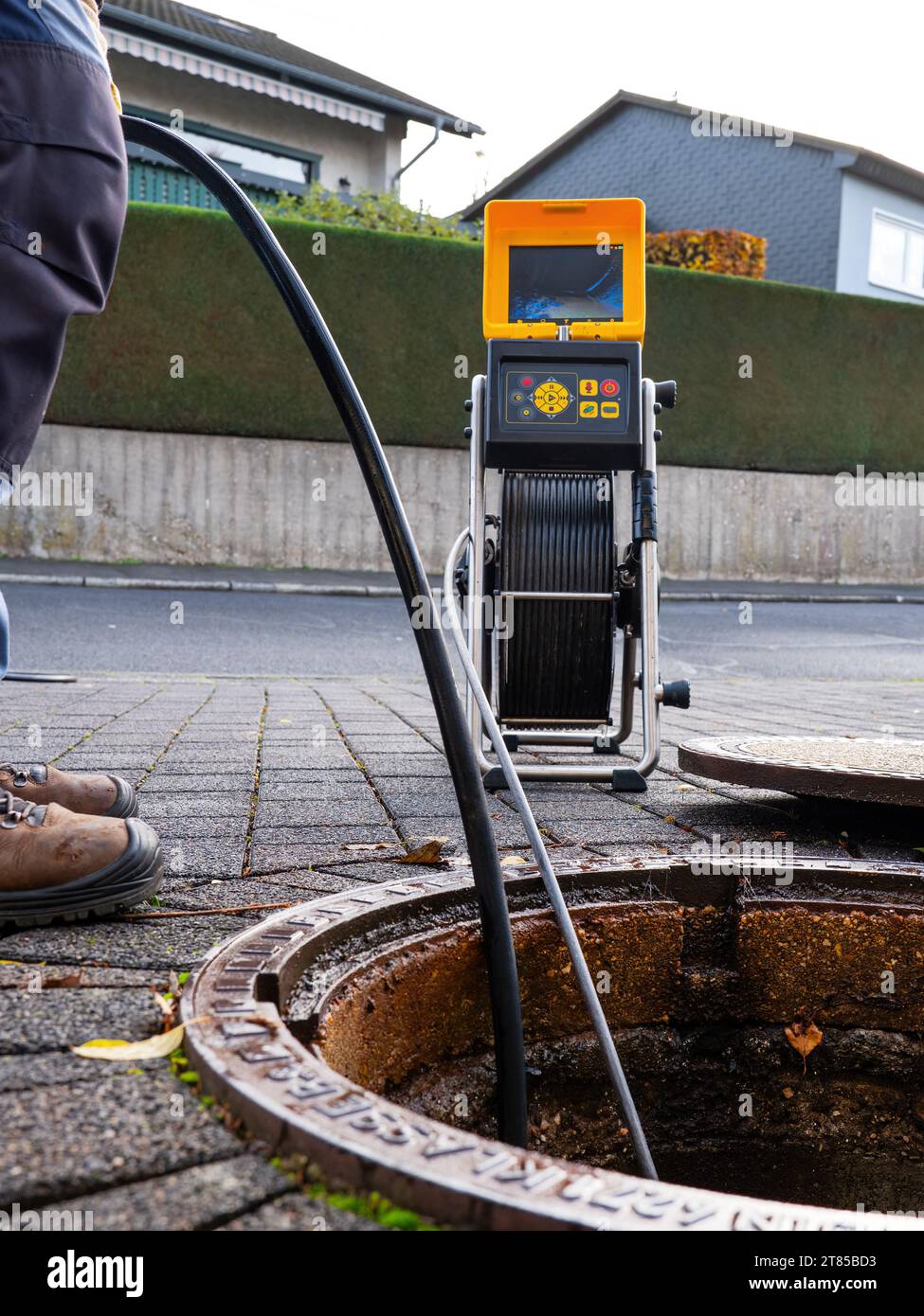 A drain cleaning company checks a blocked drain with a camera before ...