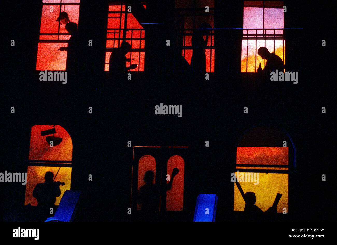 residents viewed through tenement windows at night in STREET SCENE at ...