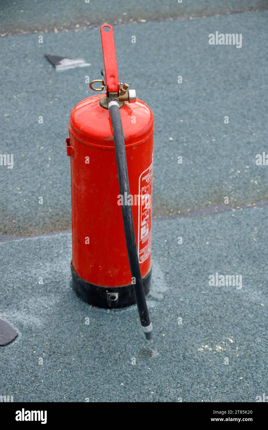 Fire extinguisher is on a construction site Stock Photo - Alamy