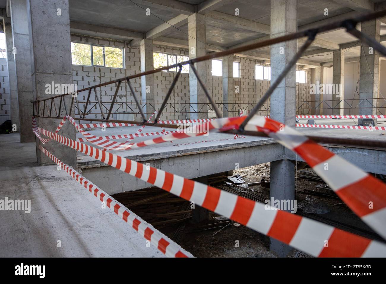 Red and White Lines of barrier tape, fencing the danger zone at a ...