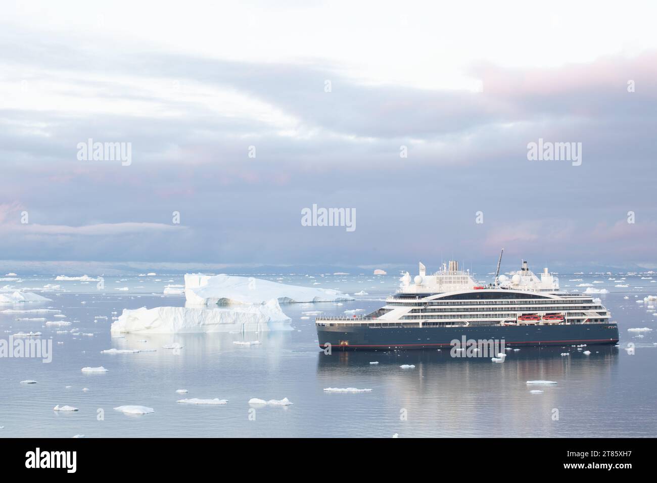 The expedition cruise ship at anchor near the port of Ilulissat in ...