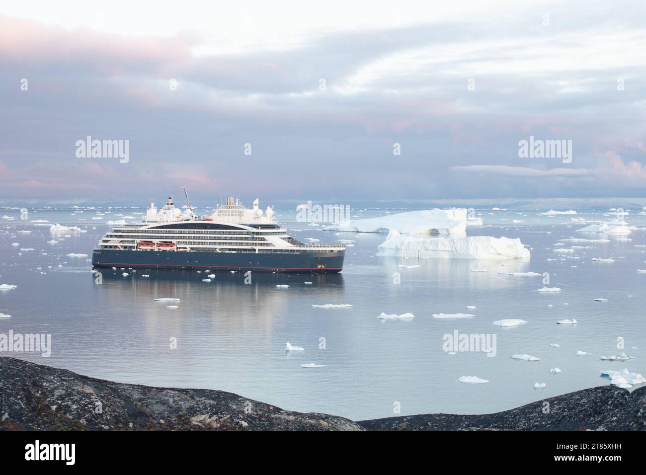 The expedition cruise ship at anchor near the port of Ilulissat in ...