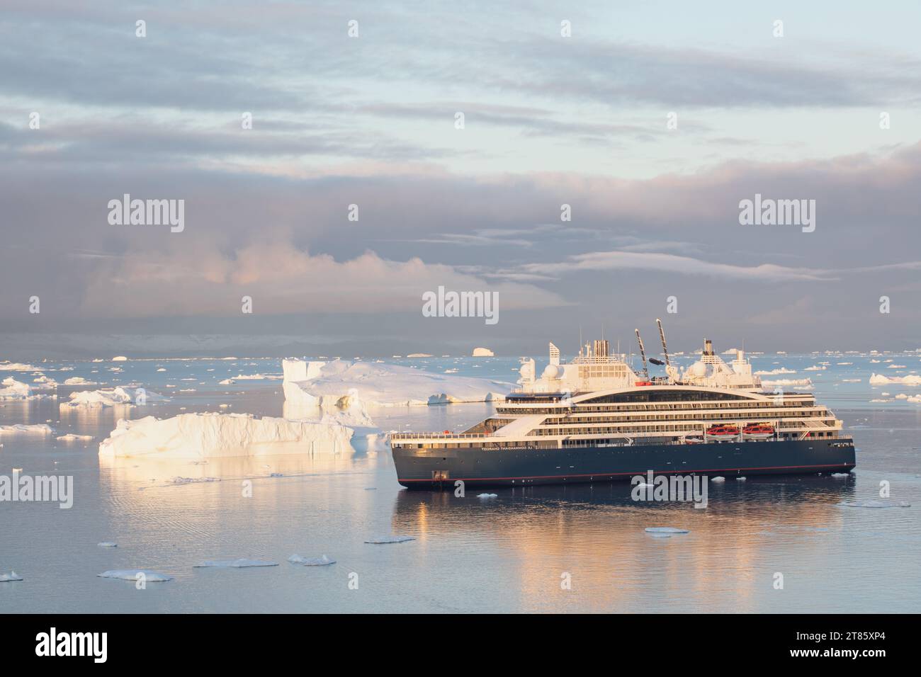 The expedition cruise ship at anchor near the port of Ilulissat in ...