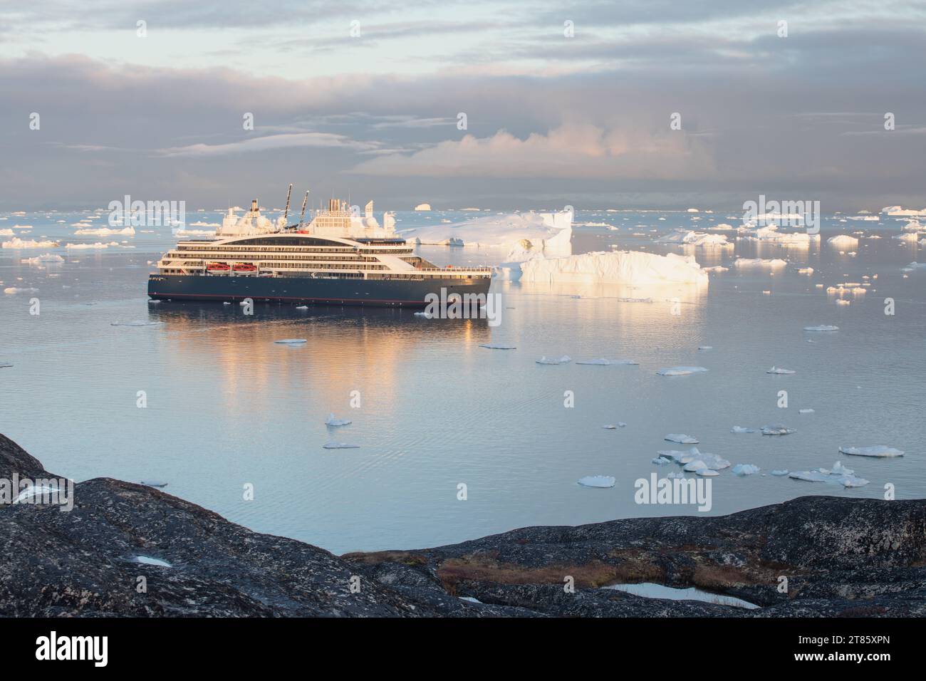The expedition cruise ship at anchor near the port of Ilulissat in ...