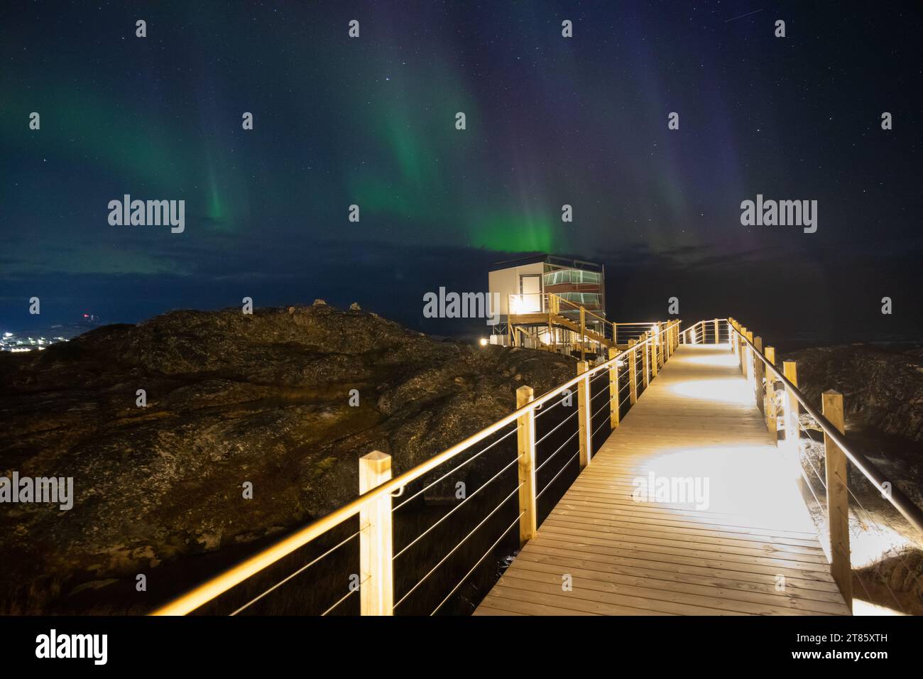 Northern Lights in Ilulissat. Arctic Greenland. Picturesque village on ...