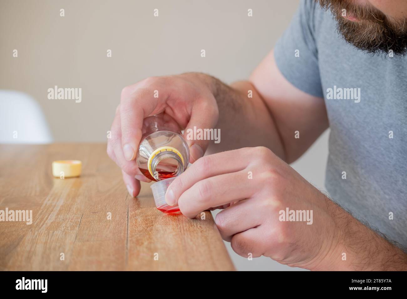 Father serving syrup to his children Stock Photo - Alamy
