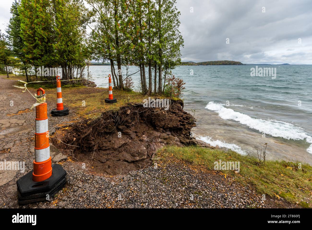 Hiking trail on the Presque Isle peninsula with a view of Lake Superior ...
