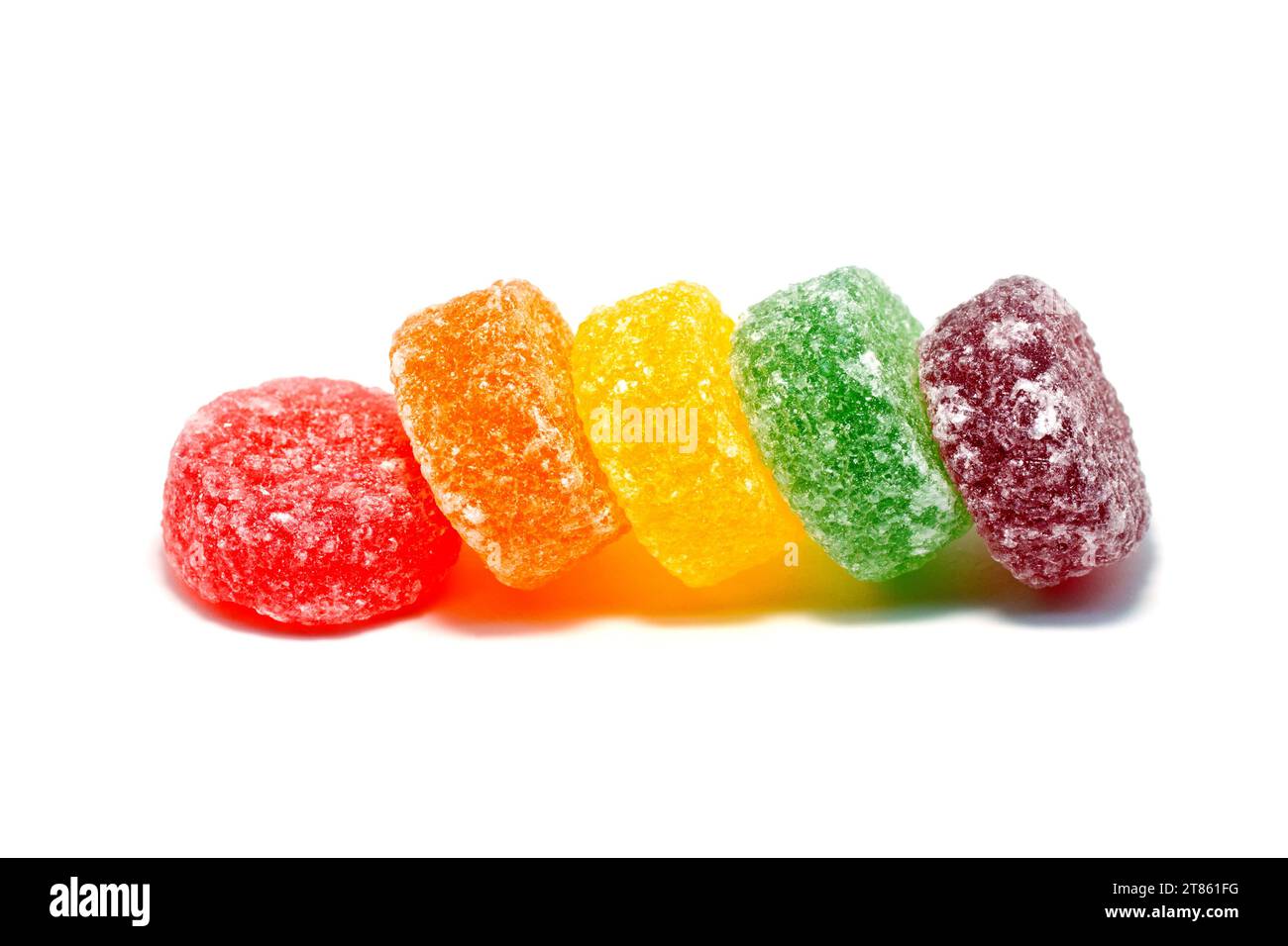 Close up of a row of colourful fruit pastilles in a rainbow pattern of ...